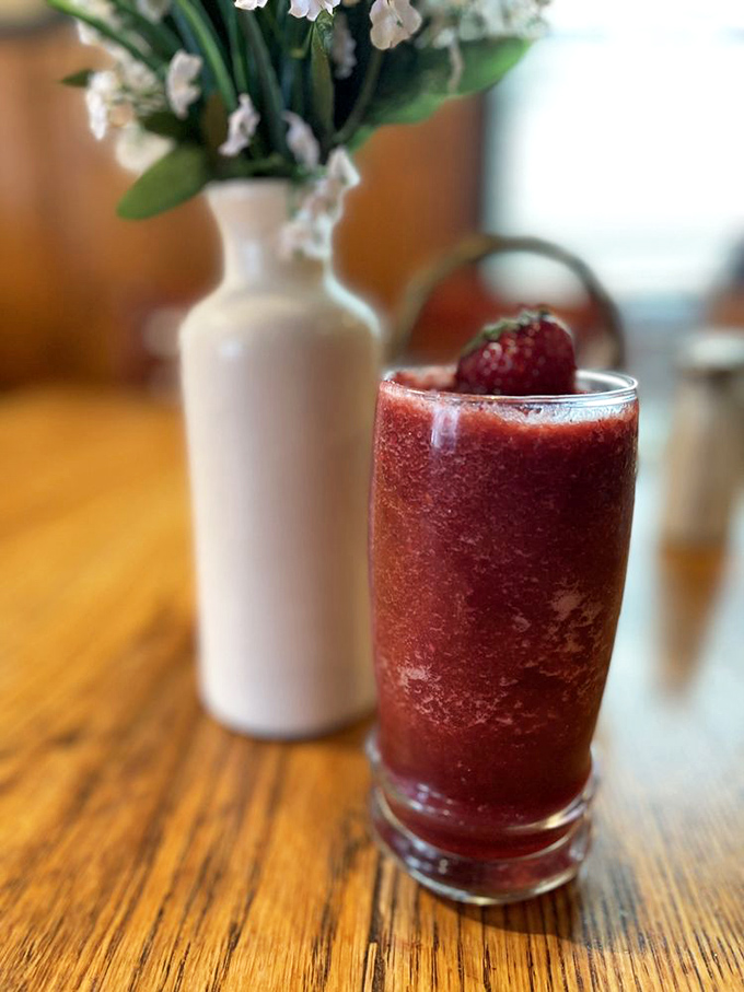Ruby red refreshment that makes you forget all about coffee&mdash;at least temporarily. This berry smoothie is summer in a glass, topped with nature's garnish.