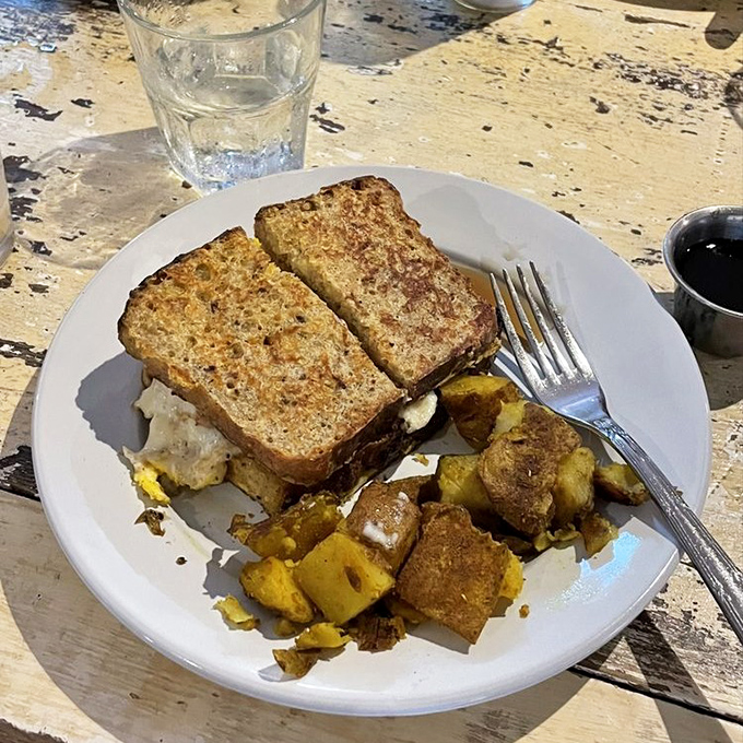 Breakfast that understands you&mdash;golden-toasted bread and seasoned potatoes that make morning meetings actually worth attending.