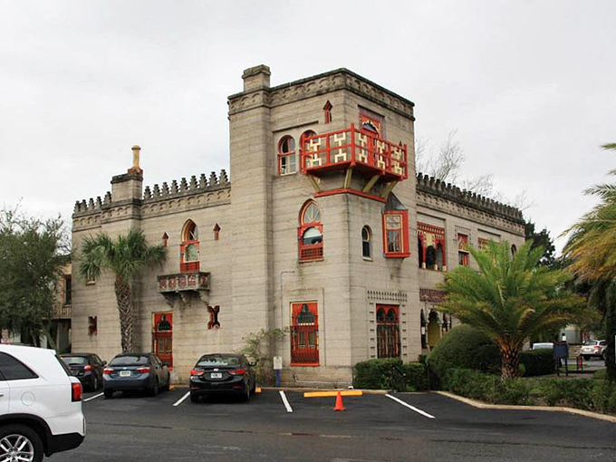 The exterior's architectural details&mdash;those distinctive red balconies and blue-tiled accents&mdash;create a visual rhythm that's both foreign and somehow perfectly at home in Florida's oldest city.