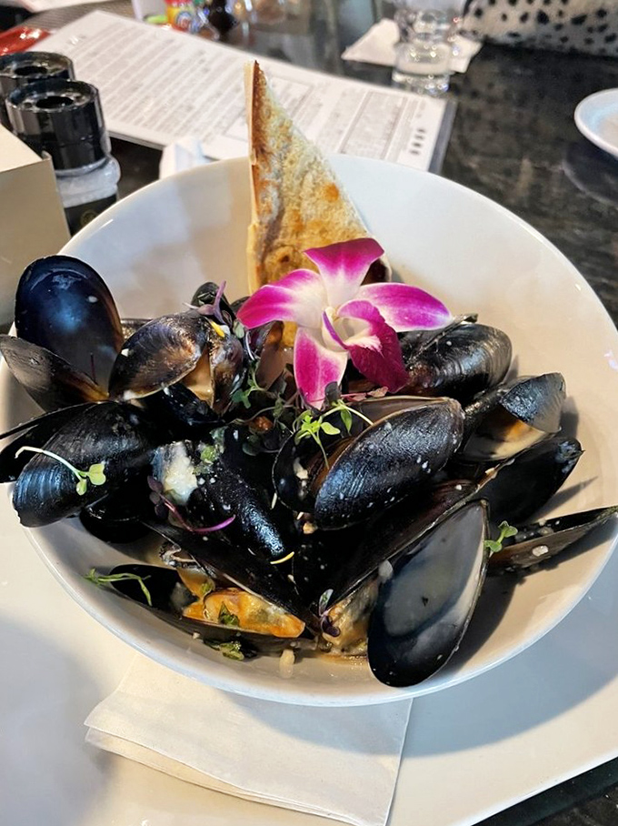 These mussels aren't just served, they're presented&mdash;a maritime treasure chest opened tableside with that grilled bread standing by for essential sauce-sopping duty.