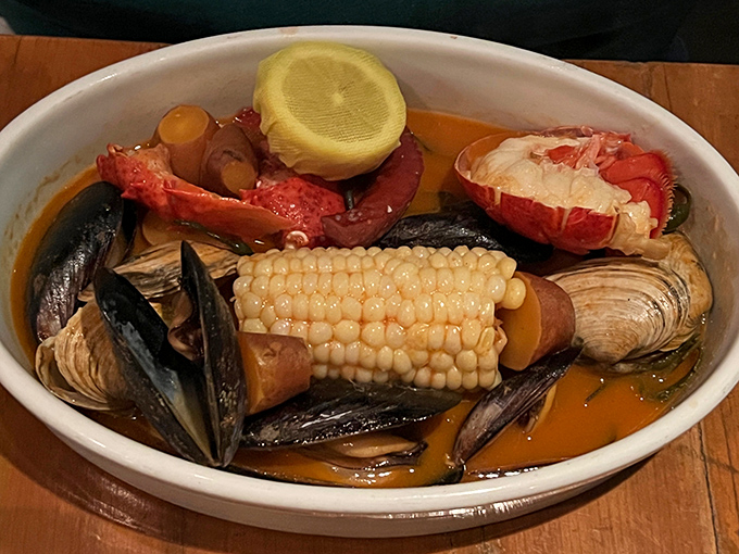 This New England boiled dinner isn't just food—it's a family reunion in a bowl, where lobster, mussels, and corn gather for a flavorful celebration.