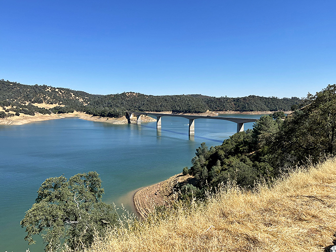 The bridge over New Melones Lake looks like it's connecting two different worlds. California gold country at its most photogenic.