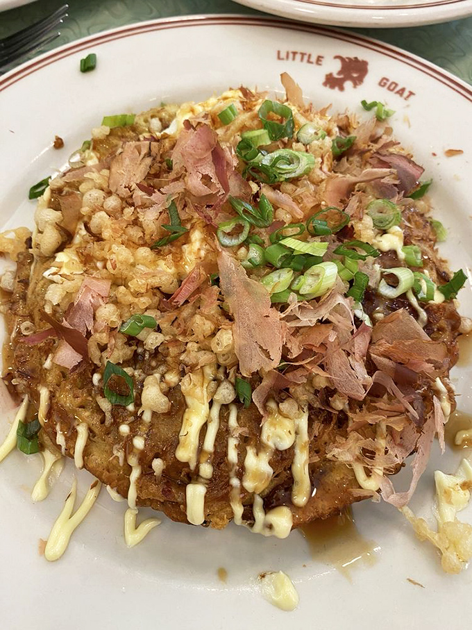 Japan meets Chicago in this Okonomiyaki&mdash;a savory pancake topped with dancing bonito flakes and drizzles that make every bite a different adventure.