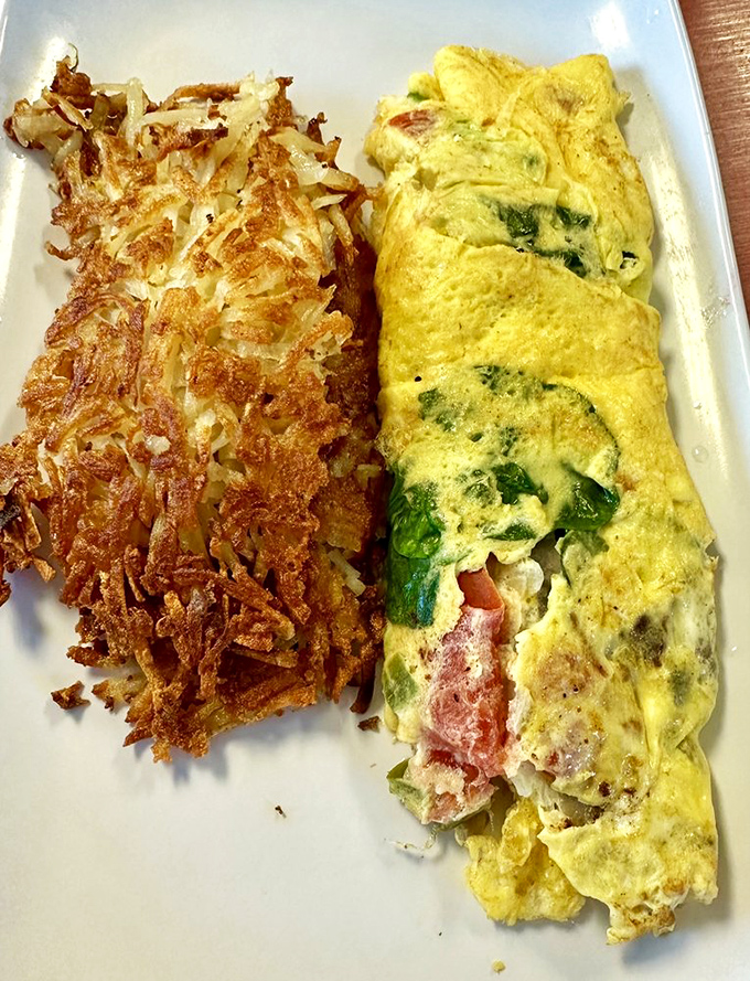 An omelet that actually contains what was promised, folded with the care of someone who understands that breakfast is serious business.