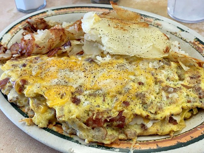 An omelet that's seen things. Specifically, it's seen ham, cheese, and various vegetables enter its eggy embrace and emerge as breakfast perfection.
