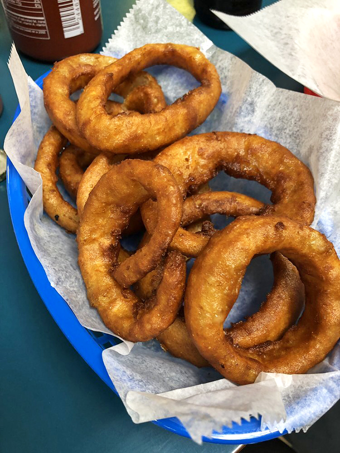 Onion rings with the structural integrity of Roman architecture. The perfect circle doesn't exist? These golden halos of happiness beg to differ.