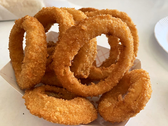 Onion rings so perfectly crispy they practically sing opera when you bite into them first.