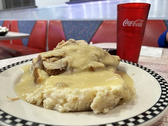 An open-faced turkey sandwich swimming in gravy&mdash;the kind of honest plate that makes you want to call your mother and thank her.