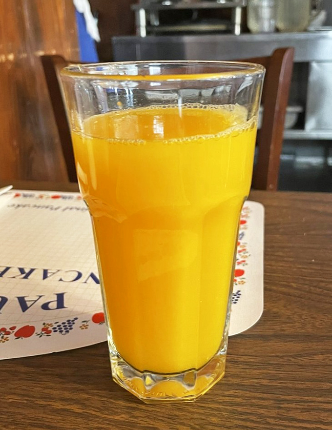 Fresh-squeezed orange juice that glows like liquid sunshine. The perfect companion to those Danish pancakes&mdash;California citrus meets Danish tradition.