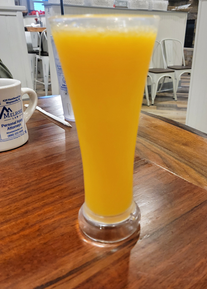 This isn't just orange juice—it's liquid sunshine in a glass tall enough to make you forget you're not actually on a beach vacation.