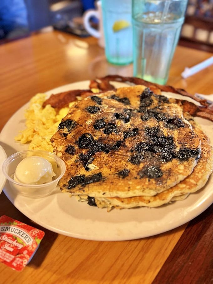 Blueberry pancakes that make IHOP weep with jealousy, served with a side of nostalgia and enough butter to make your cardiologist nervous.