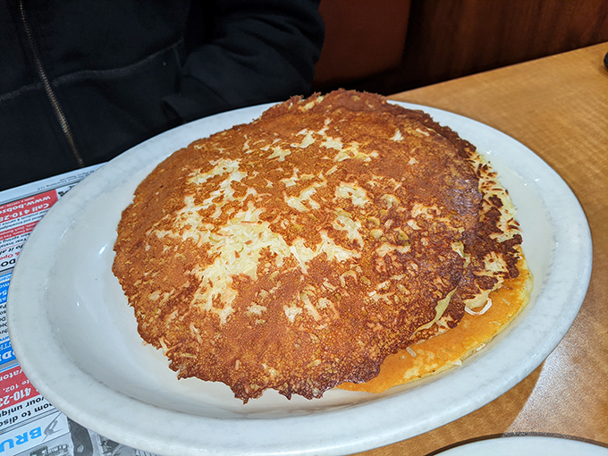 This pancake isn't just large&mdash;it's the size of a hubcap with the golden-brown hue that breakfast dreams are made of.