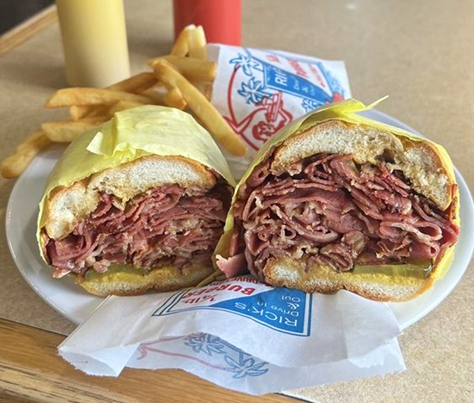 Pastrami piled high like a delicious skyscraper - this sandwich means serious business and delivers.