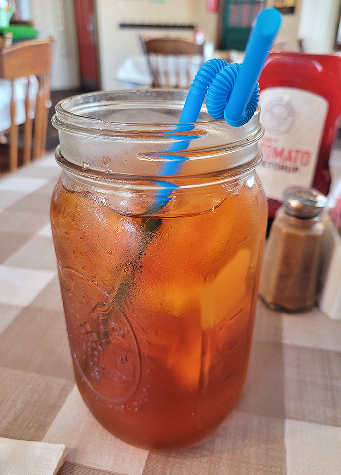 Mason jar iced tea&mdash;where Southern tradition meets Pennsylvania hospitality, complete with that blue swirly straw that makes everything taste better.