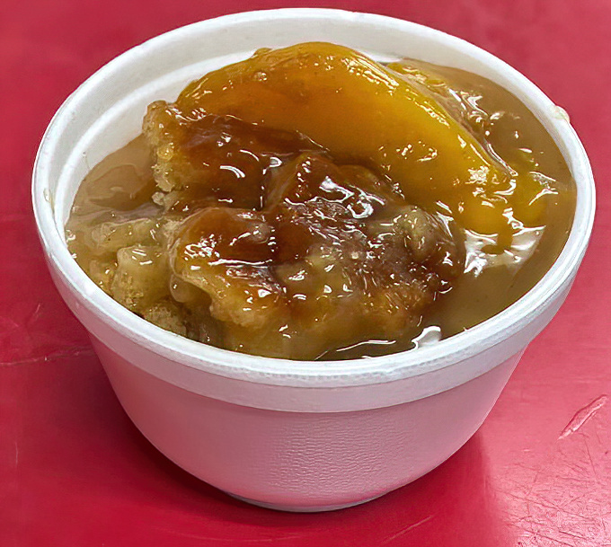 Peach cobbler that doesn't need fancy plating or Instagram filters. Just honest-to-goodness Georgia sweetness in a humble takeout container.