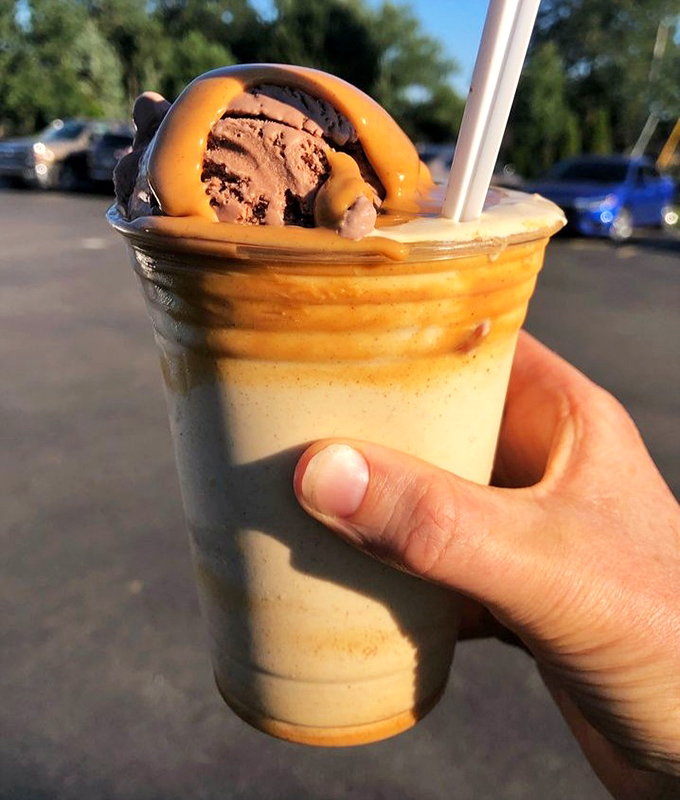 Peanut butter cascading over ice cream with chocolate accents &ndash; this shake isn't just a dessert, it's performance art in a cup.