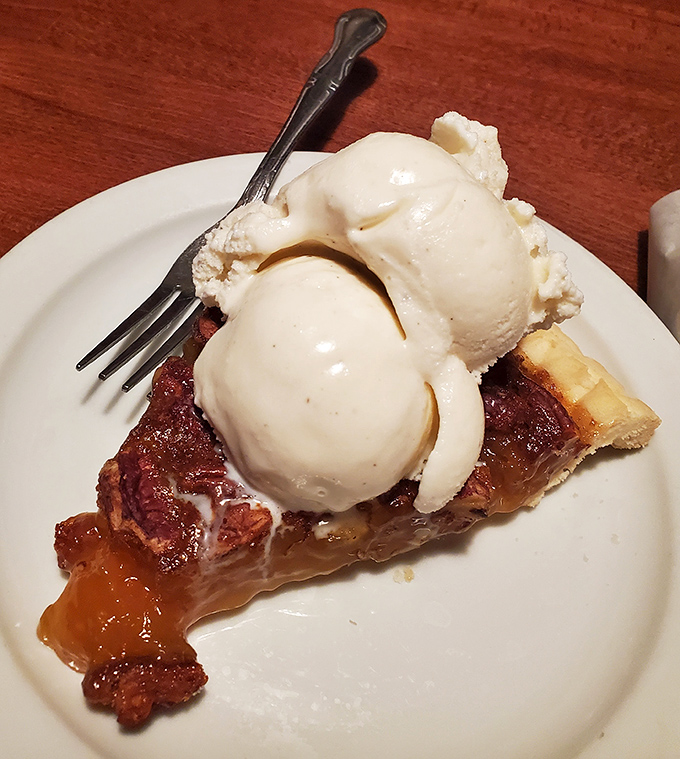 Pecan pie with ice cream: because after all that savory, your sweet tooth deserves its moment in the spotlight too.