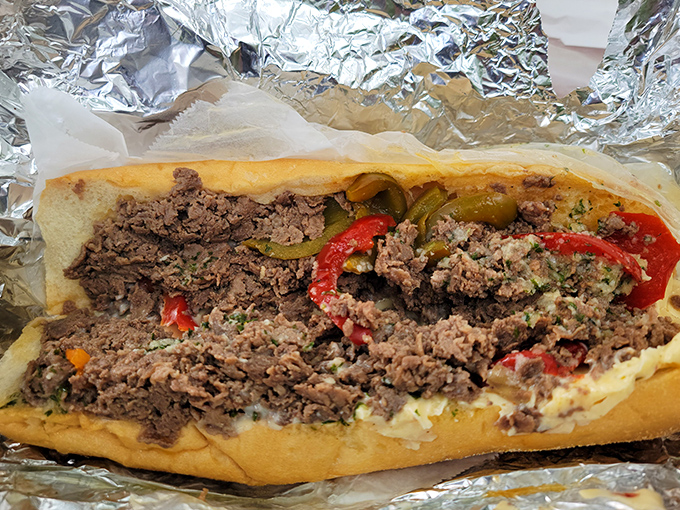 The marriage of thinly chopped steak, melted cheese, and peppers creates a sandwich so perfect it deserves its own Pennsylvania state holiday.