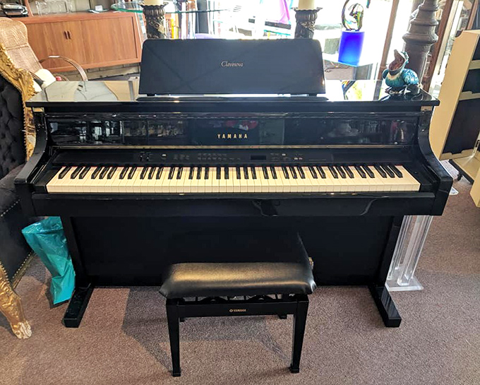 Keys to the past! This gleaming Yamaha piano isn't just an instrument—it's an invitation to bring music from another era into your home.