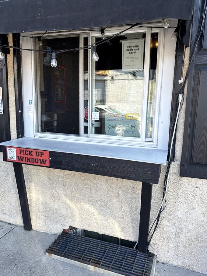 The pick-up window: where dreams come true. A portal to flavor town that's been serving the neighborhood's cravings rain or shine.