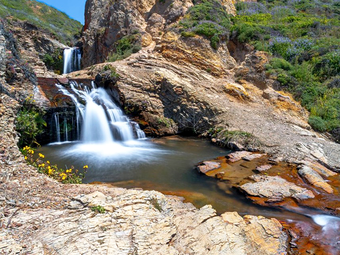 Water tumbles between ancient rock formations, creating pools that reflect California's impossibly blue skies &ndash; nature's infinity pool without the resort prices.