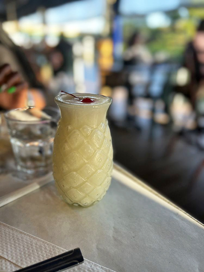 This piña colada isn't just a drink—it's vacation in a pineapple-shaped glass, no plane ticket required. Jimmy Buffett would approve.