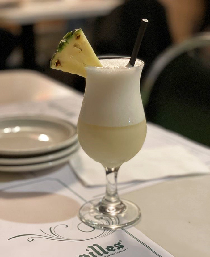 A pi&ntilde;a colada that transports you straight to vacation mode &ndash; creamy, tropical, and garnished with a slice of paradise.