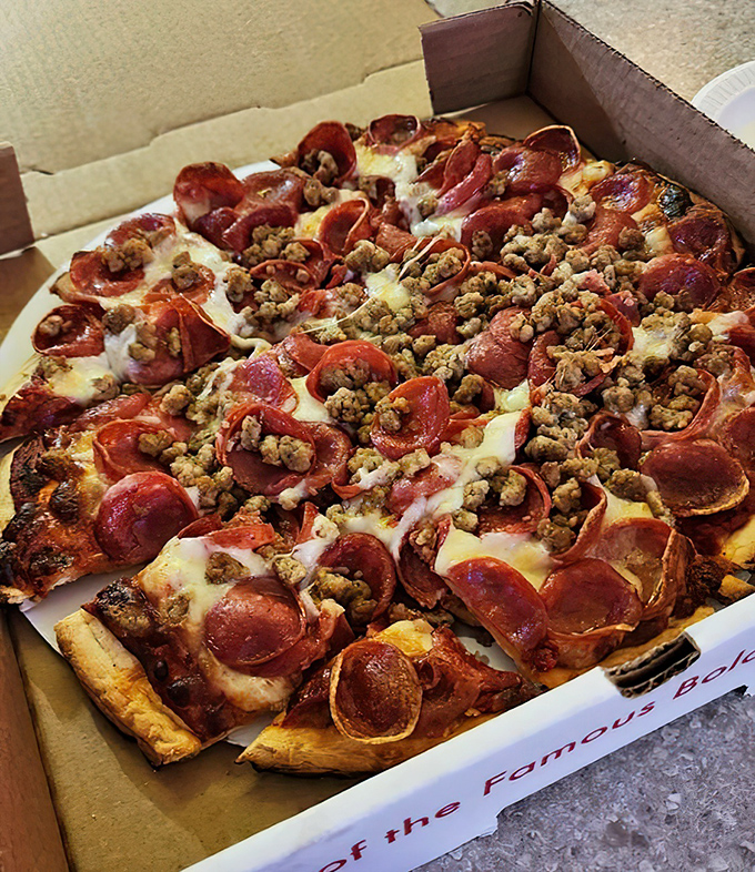 Pizza that doesn't try to be artisanal or authentic Italian &ndash; just deliciously American with a generous blanket of pepperoni and sausage.