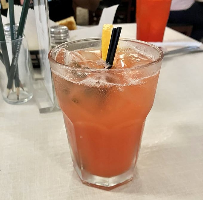 The Ponce Punch arrives like liquid Southern sunshine, promising refreshment with just enough kick to make dinner conversation flow more freely.