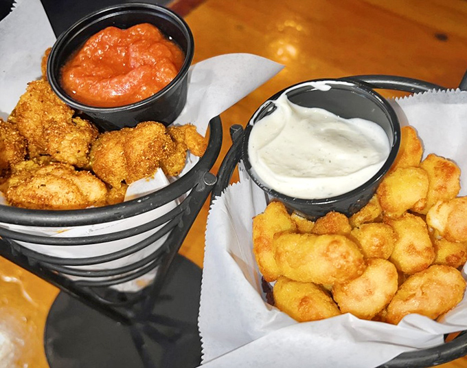 Popcorn shrimp and cheese curds: the dynamic duo of appetizers. Like Batman and Robin, if they were delicious and came with dipping sauce.