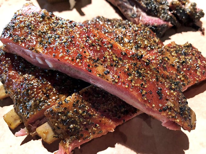 Pork ribs that glisten like edible jewelry, each one a masterpiece of smoke, spice, and everything nice.