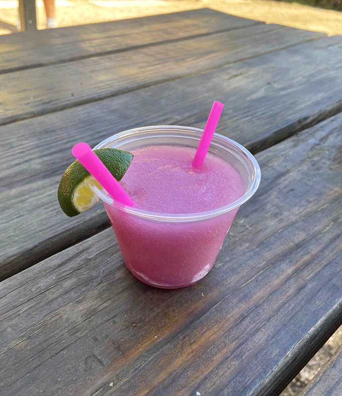 A prickly pear margarita that's as Texas as it gets. The pink hue isn't just pretty—it's practically winking at you.