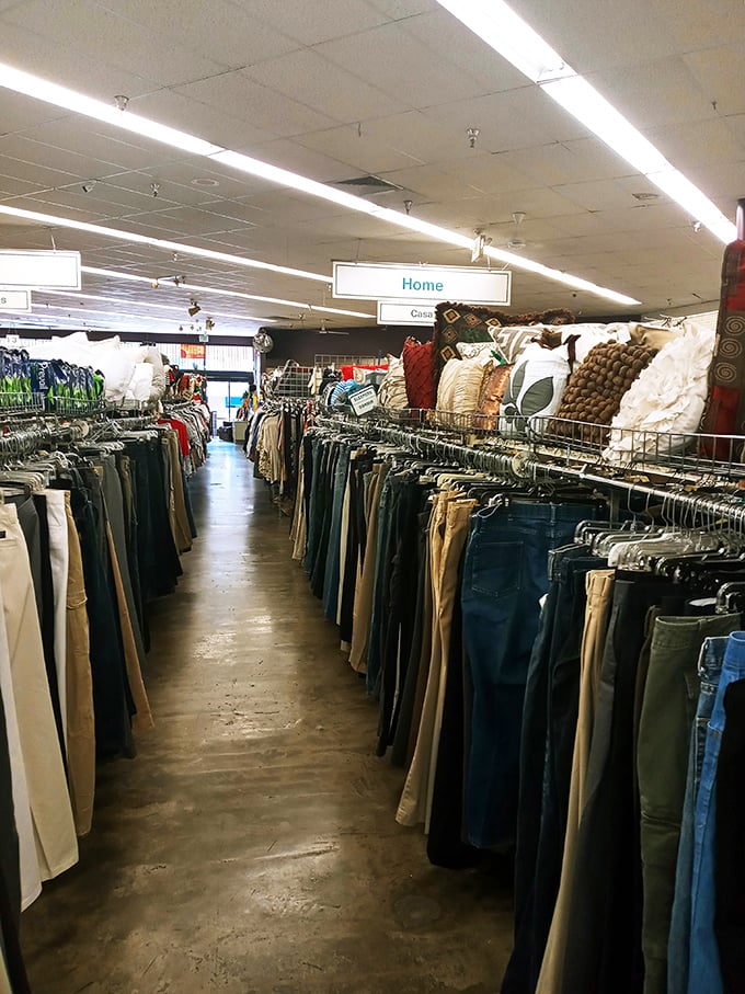 The men's pants section stretches toward infinity like a denim galaxy. Finding your size here feels like winning a retail scavenger hunt.