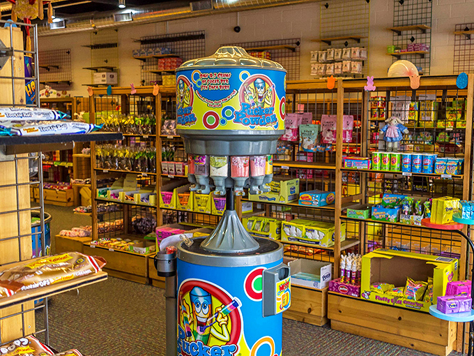 The Pucker Powder station stands like a sugary sentinel, dispensing colorful, sour dust that will have your taste buds questioning your life choices.