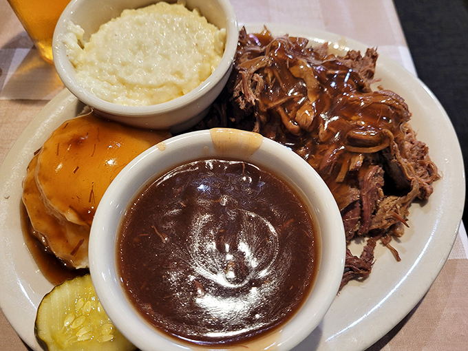 A plate that honors the holy trinity of Southern comfort: pulled pork, gravy, and homemade sides. Napkins required, regrets impossible.