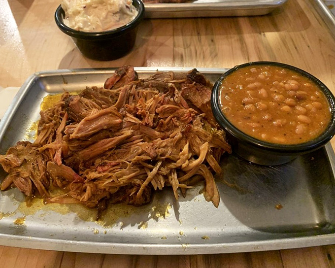 Pulled pork that's had a long, meaningful relationship with smoke and spice, served alongside beans that didn't come from any can.