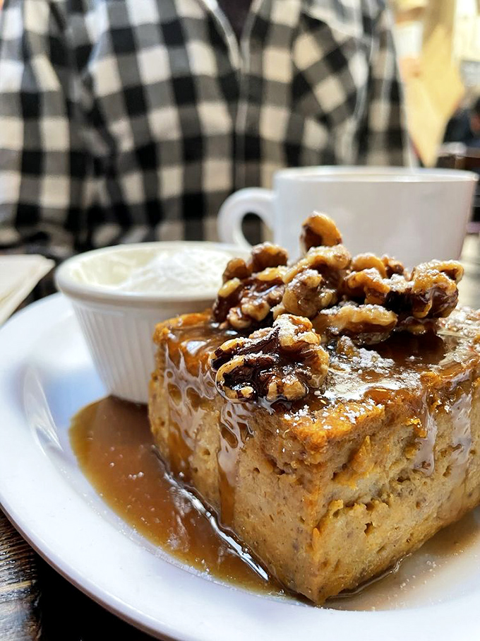 This isn't just bread pudding &ndash; it's an architectural masterpiece of comfort food, topped with pecans that add the perfect crunch factor.