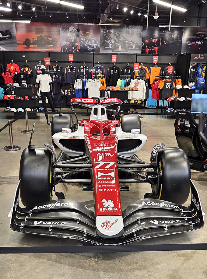 Formula One meets fashion. Nothing says "I'm compensating for something" quite like parking a race car in the middle of your retail space.