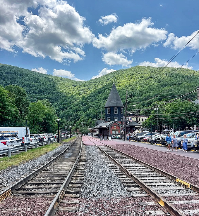 Railroad tracks stretch toward mountains that seem to open just enough to welcome visitors, a reminder of Jim Thorpe's important railway heritage.
