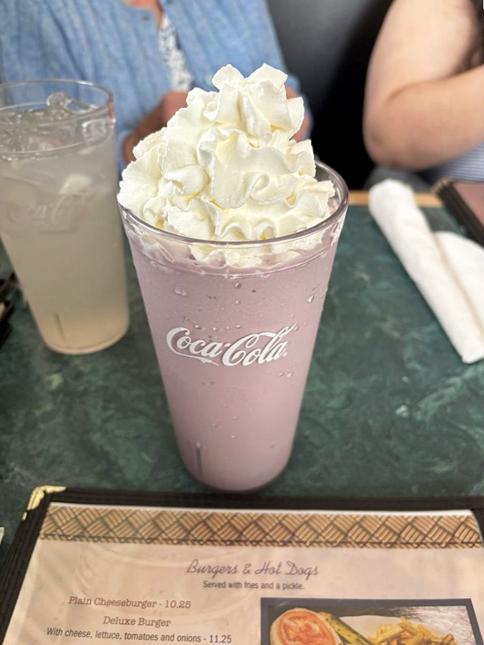 That's not just a milkshake; it's a pink cloud topped with whipped cream that makes adults remember why being a kid was so magical.