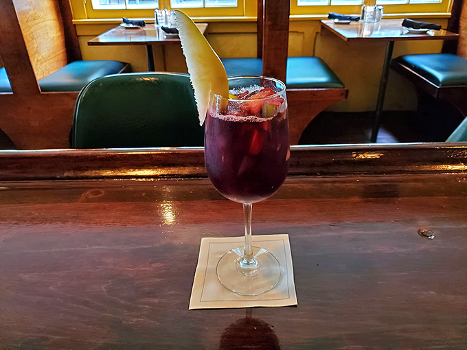This sangria isn't just a drink&mdash;it's a vacation in a glass, complete with a pear slice passenger ready for the journey.