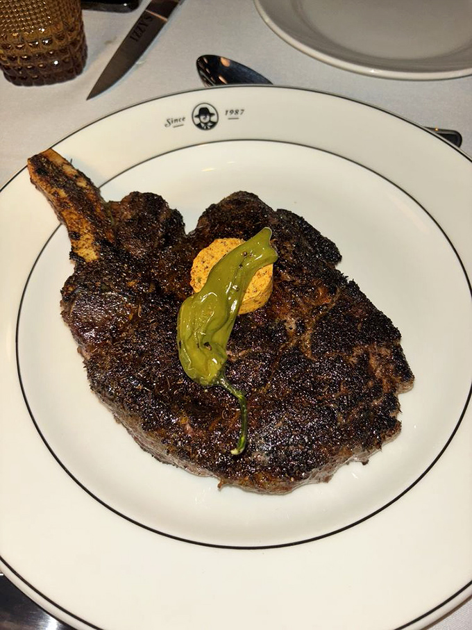 This ribeye wears its char marks like badges of honor, promising flavors that'll make your taste buds stand and salute.