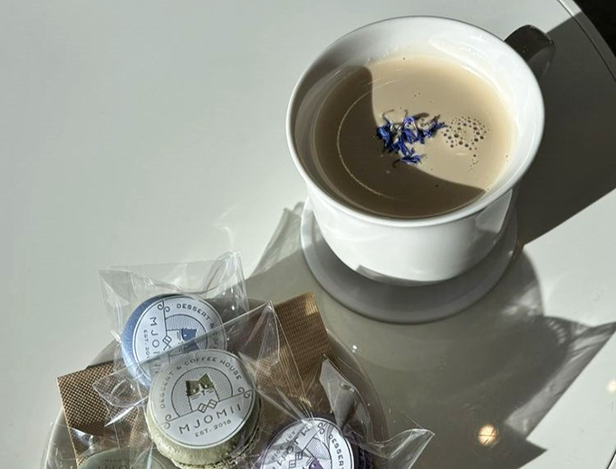 A moment of zen in a teacup, complete with edible blue flowers. Some people meditate; others just need good tea.