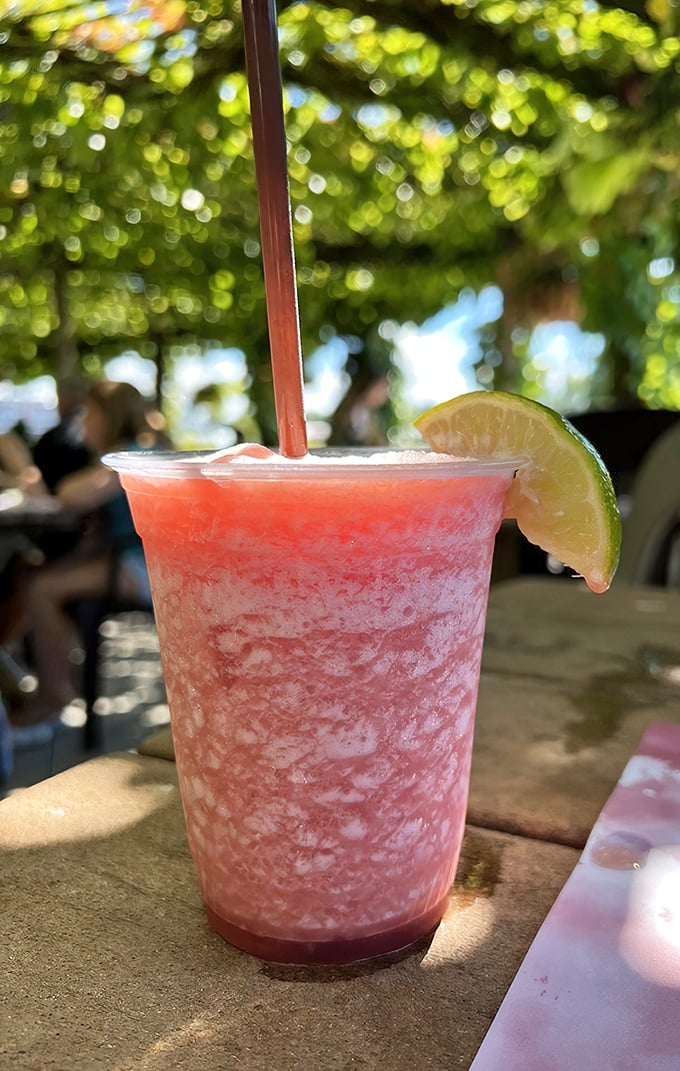 This isn't just a frozen drink—it's summer in a cup. The rum runner, with its lime garnish, practically demands you slow down and enjoy the view.