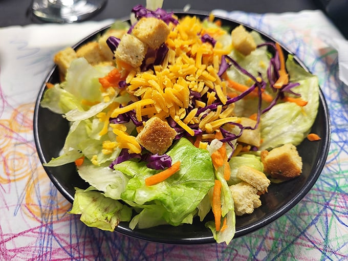 A garden-fresh salad provides the illusion of virtue before diving into the main event. Even vegetables taste better in the presence of legendary fried chicken.