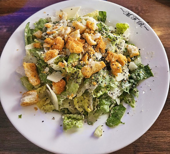 Even the Caesar salad gets the maritime treatment, with fresh greens, shaved parmesan, and croutons that provide the perfect crunch between seafood courses.