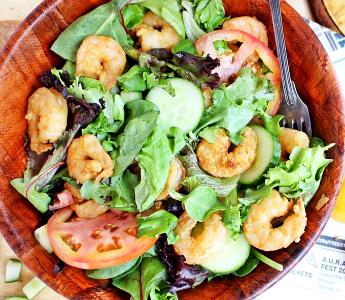 Fresh greens topped with plump shrimp create a salad that actually satisfies your soul.