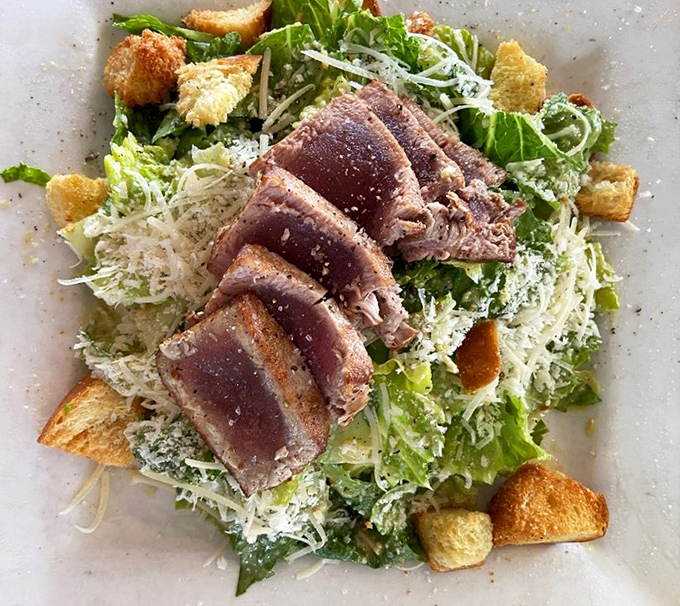 A Caesar salad gets the VIP treatment with perfectly seared tuna and homemade croutons that crunch like they mean business.