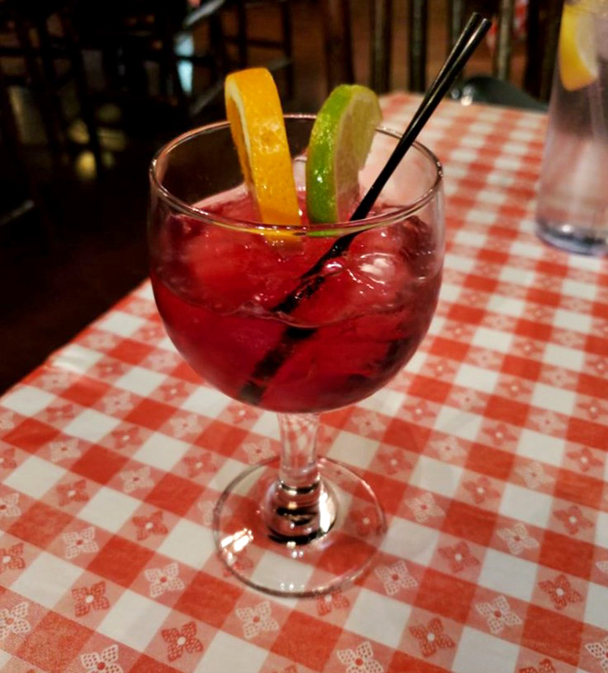 A proper western feast deserves a proper toast. This sangria, adorned with citrus slices, brings a splash of color to the checkered landscape.
