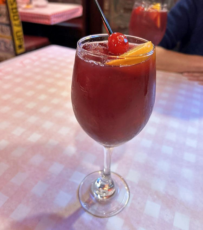 Sangria that looks like liquid sunset in a glass. The fruit isn't garnish&mdash;it's taking a well-deserved spa day.